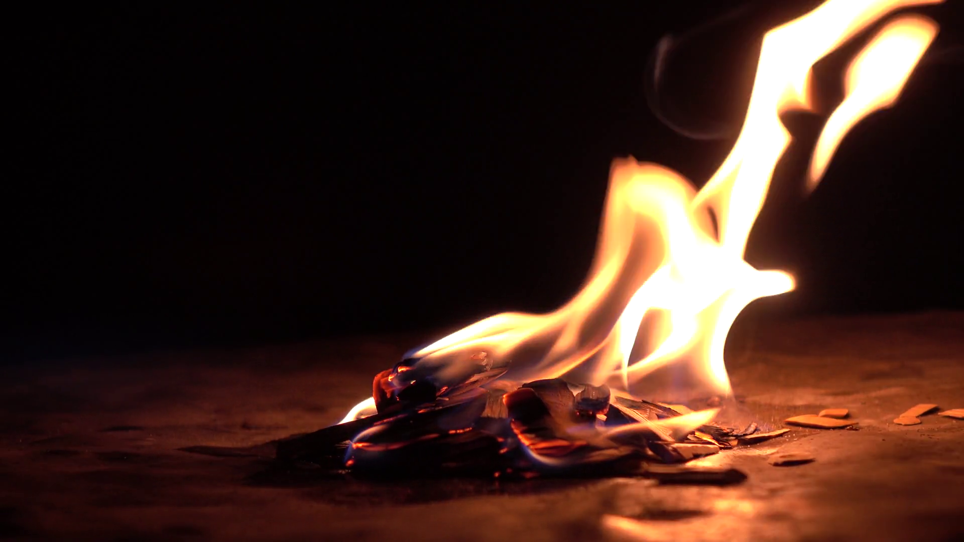burning-wood-in-the-dark-small-fire-against-black-background-4k-close ...